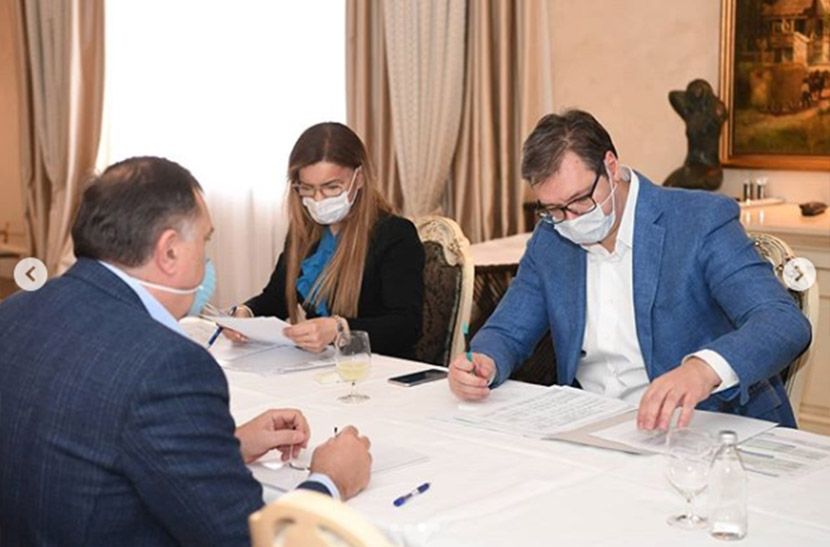 Vucic and Dodik wear masks as they meet in Belgrade to discuss ...